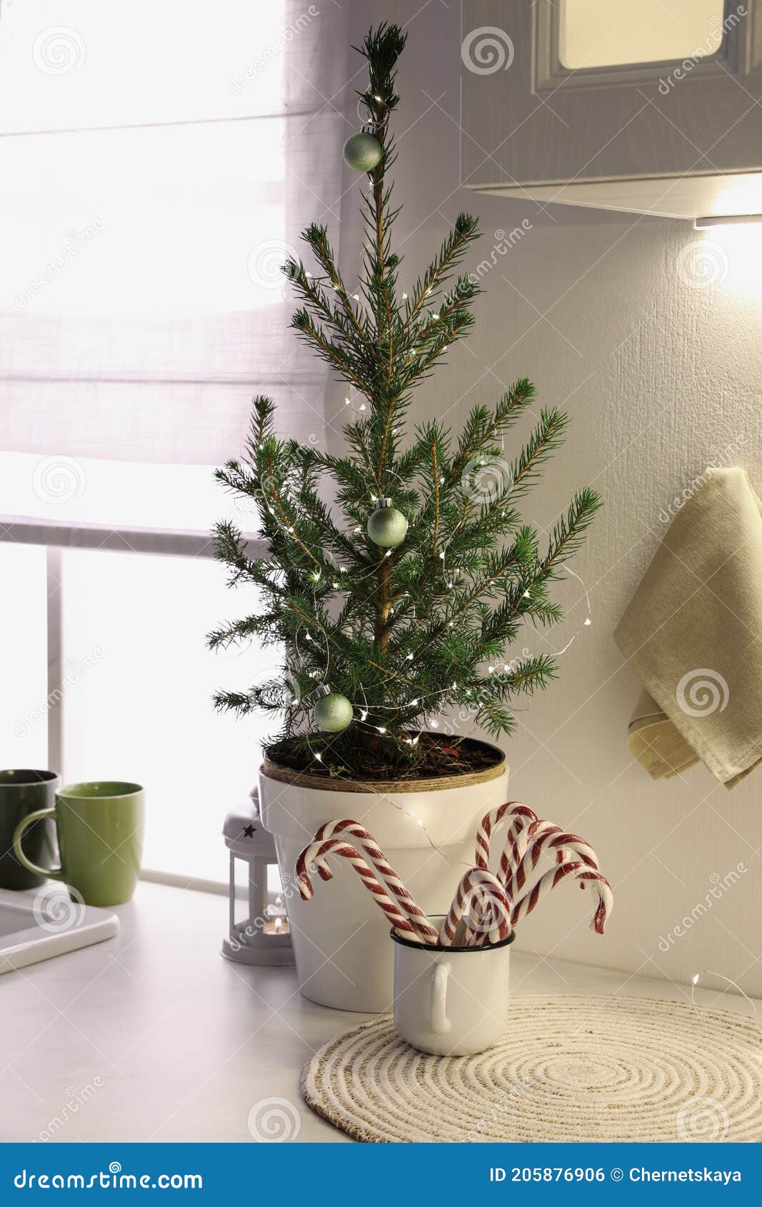 Small Christmas Tree and Festive Decor on Countertop in Kitchen Stock ...