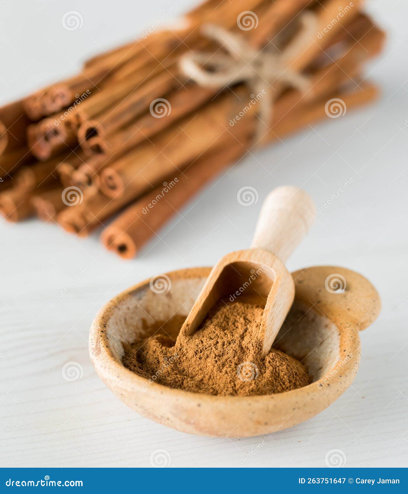 A Small Clay Pottery Bowl of Cinnamon Powder with Cinnamon Sticks in ...