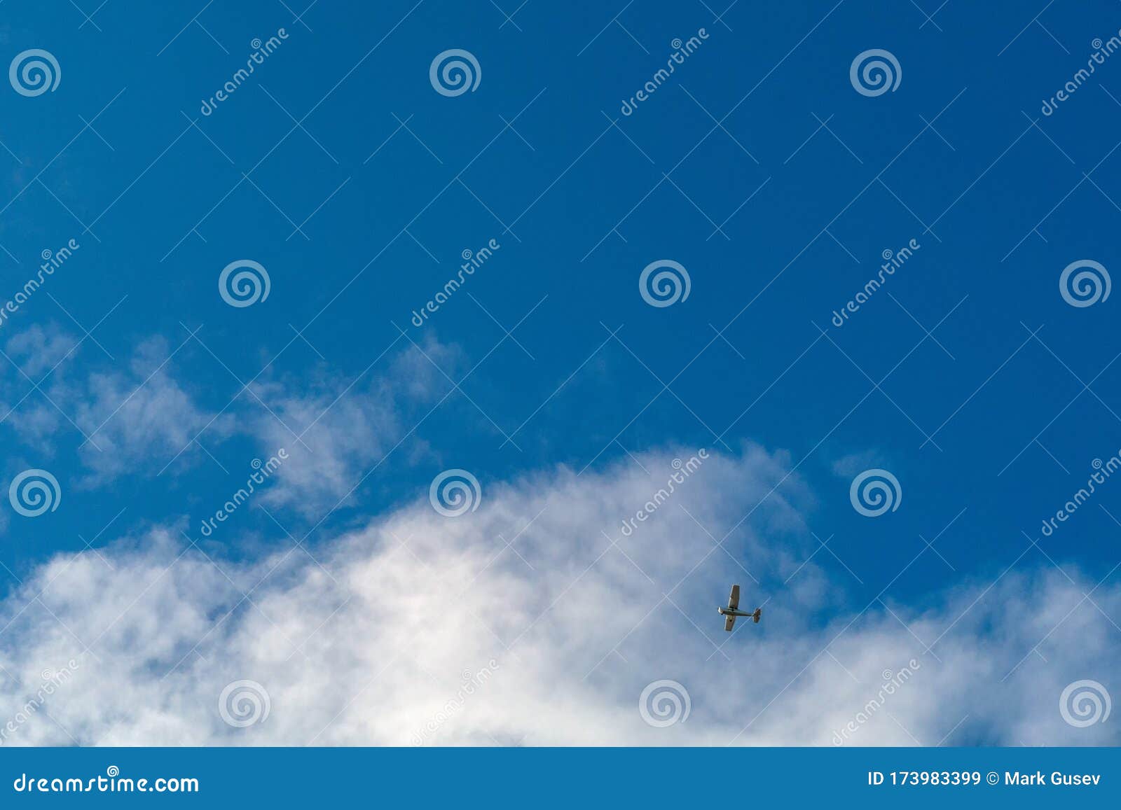 Small Commercial Airplane Flying High in a Cloudy Sky Stock Image ...
