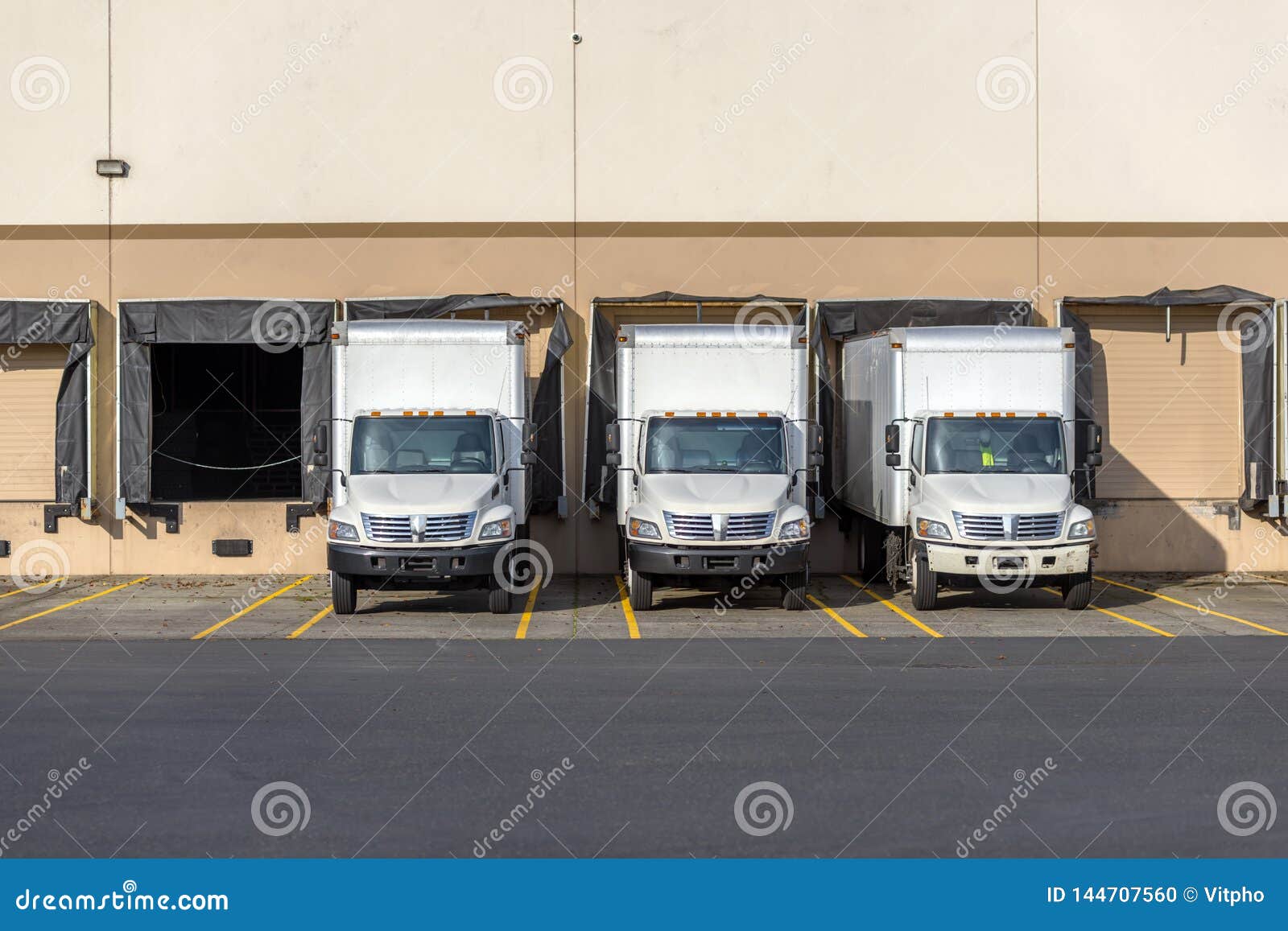 Small Compact Rigs Semi Trucks with Box Trailers Standing in Row at ...