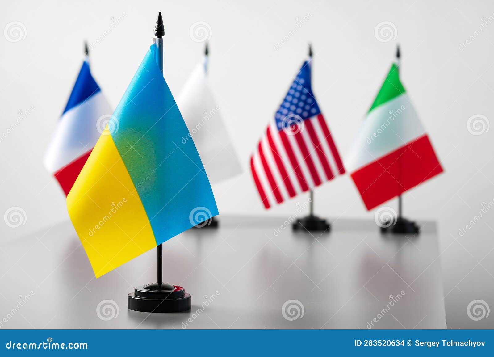 Small Country Flags Standing at a Table Stock Photo - Image of symbol ...