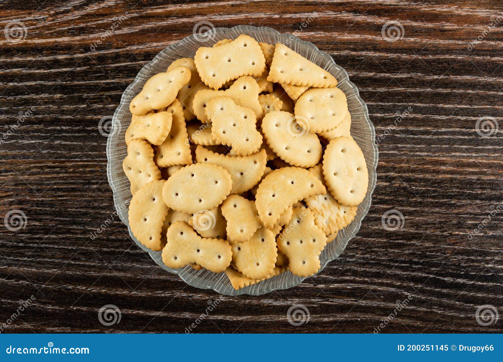 Crackers Different Shape in Bowl on Wooden Table. Top View Stock Image ...