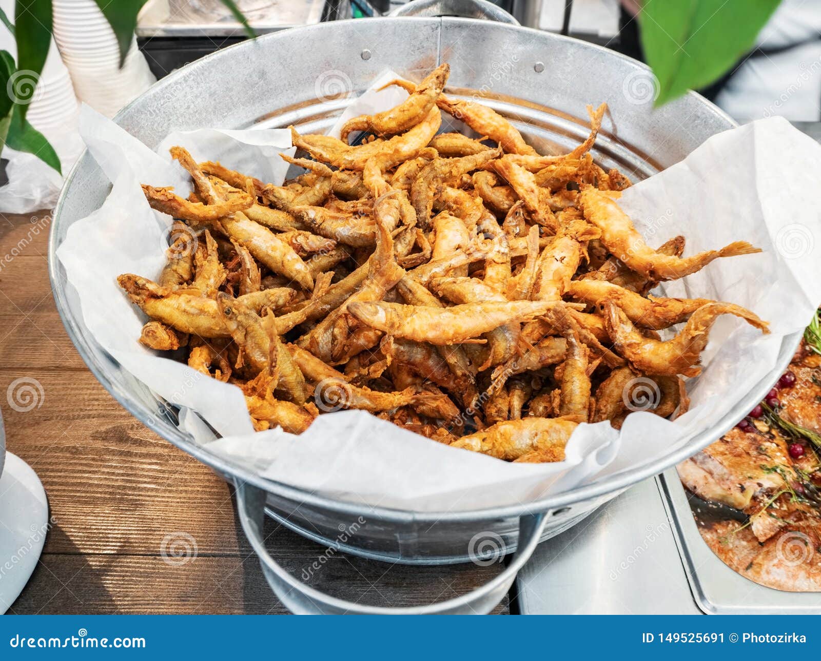 Pan Fried Capelin Or Smelt Fish On A Rectangular Plate On A Dark Gray ...