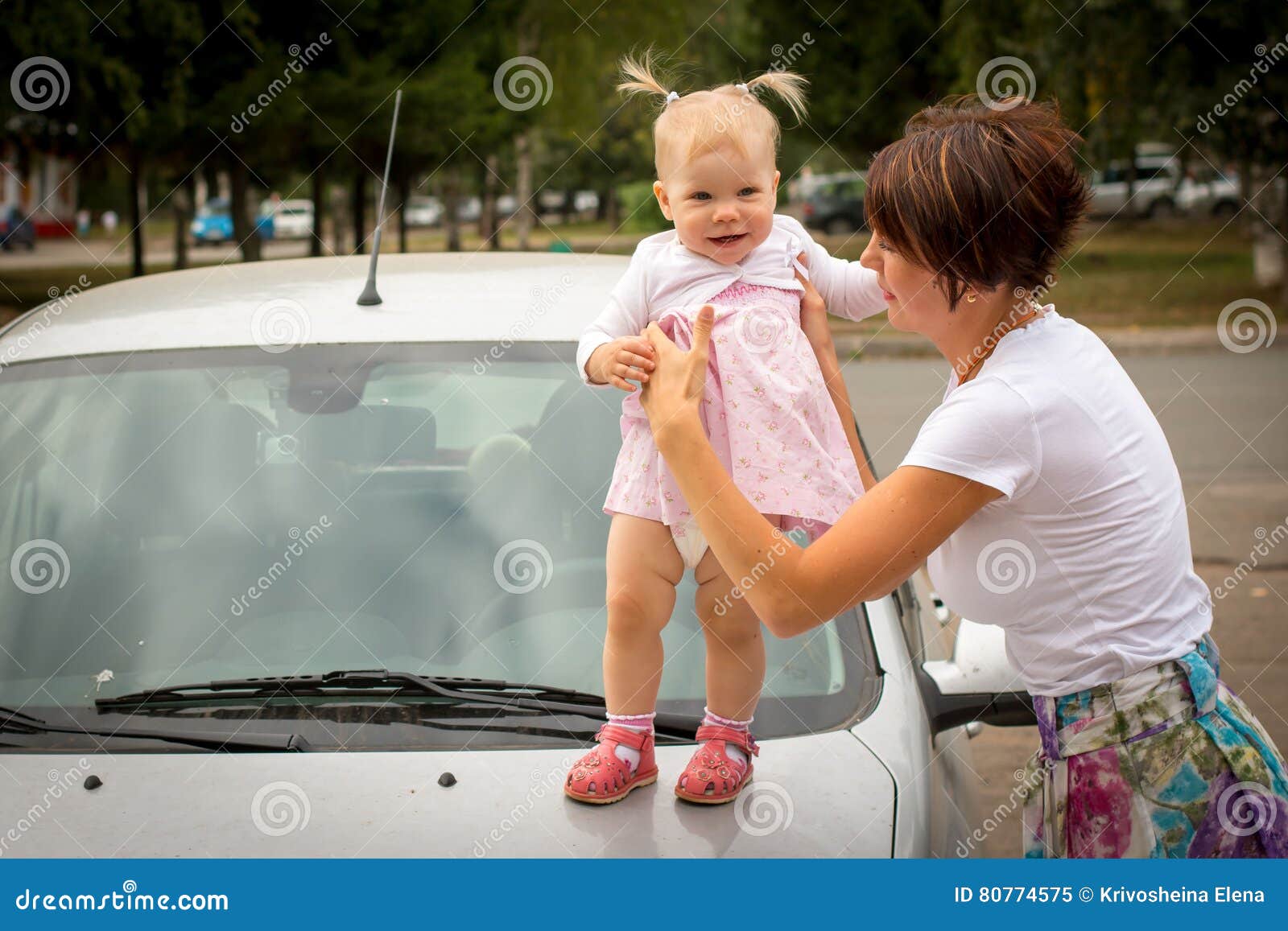 Small Cute Baby on the Car and Mom Stock Image - Image of woman, wheel ...