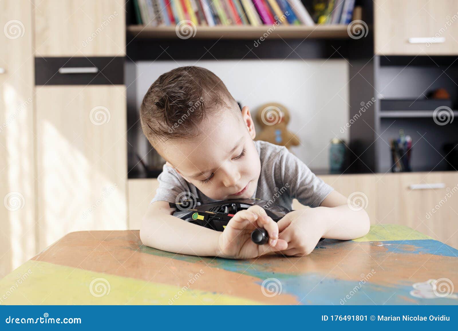 Small Cute Boy Fixing a Toy Car with a Plastic Screwdriver Stock Image ...