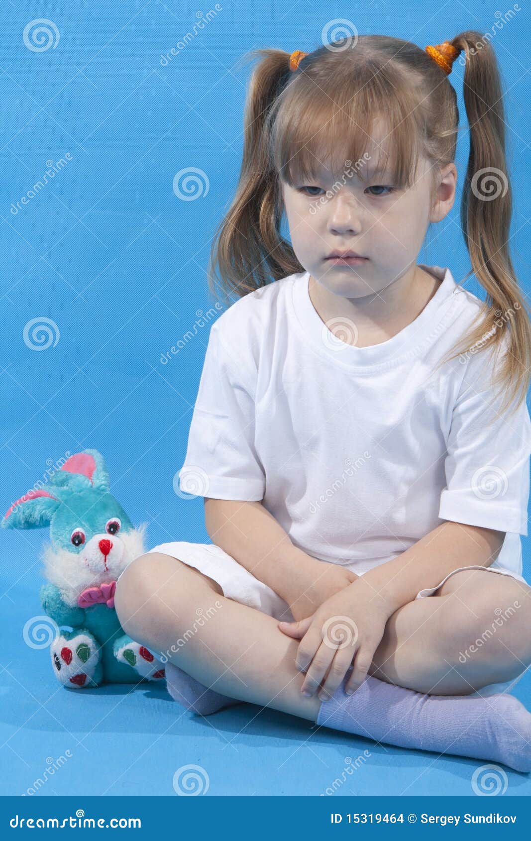 Small Cute Girl is Posing on Blue Background Stock Photo - Image of ...