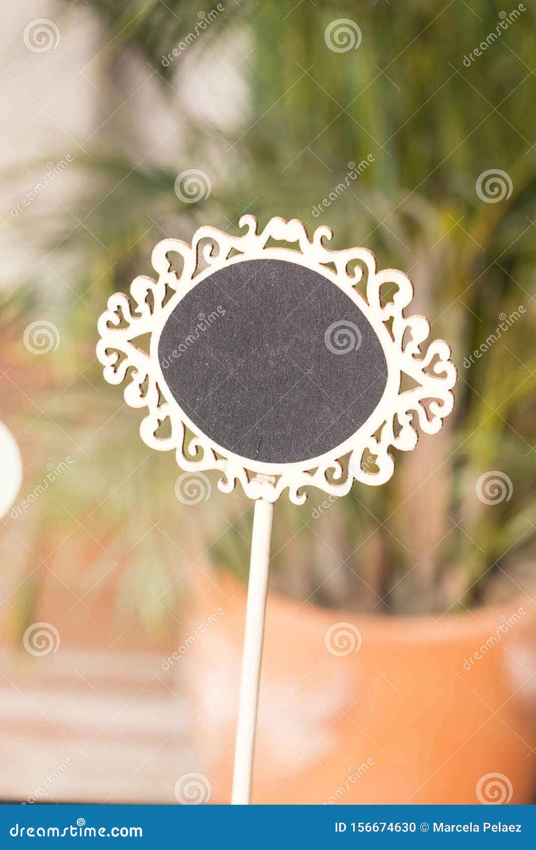 Small Decorative Board with White Elegant Frame and Unfocused Green ...