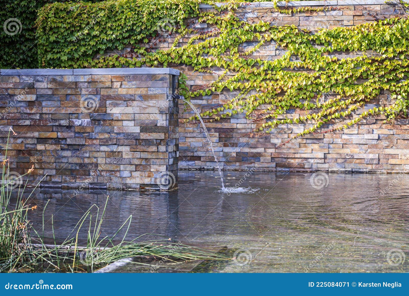 A Small Decorative Waterfall in the Garden. Landscape Design Stock ...