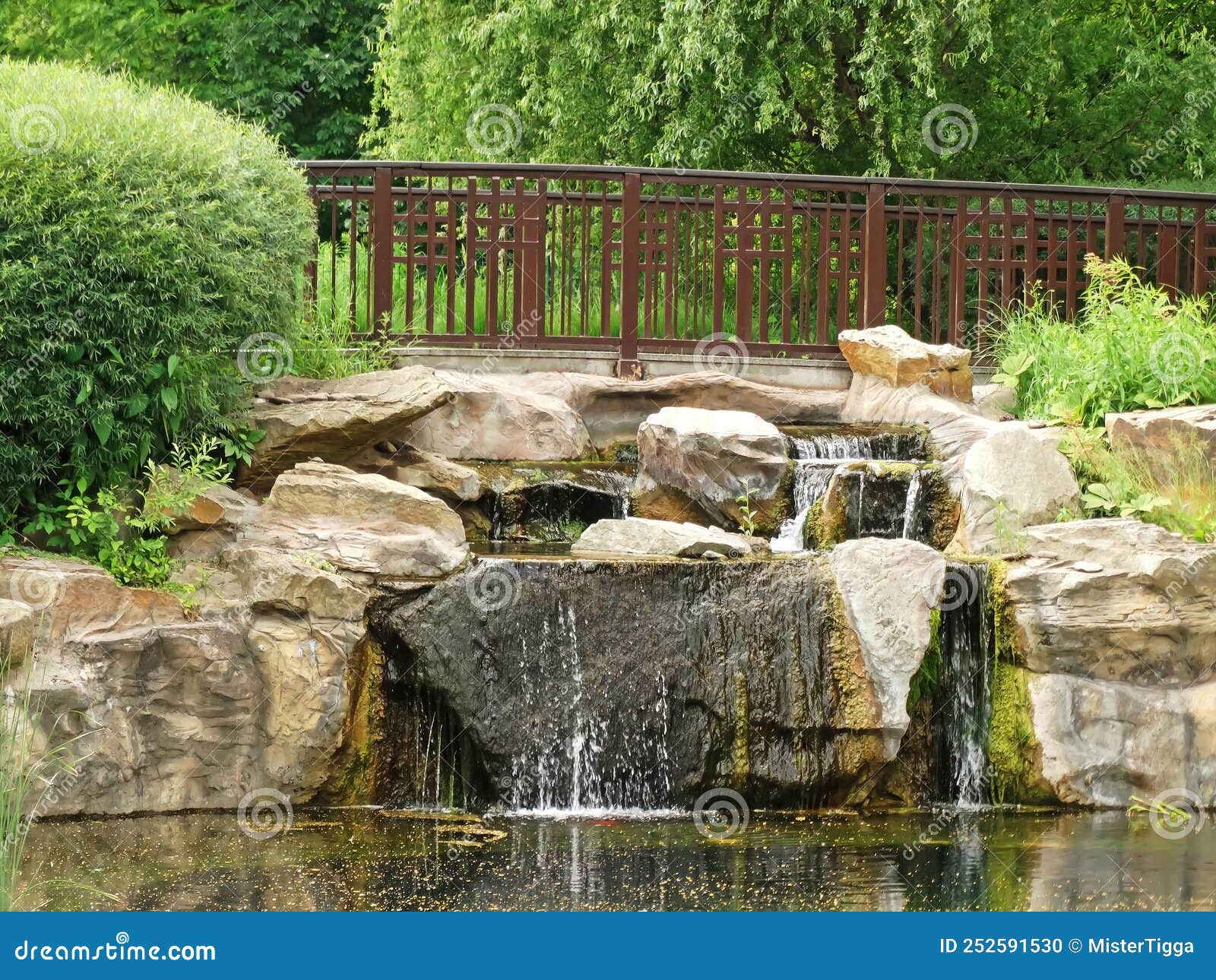 A Small Decorative Waterfall in the Garden. Landscape Design Stock ...
