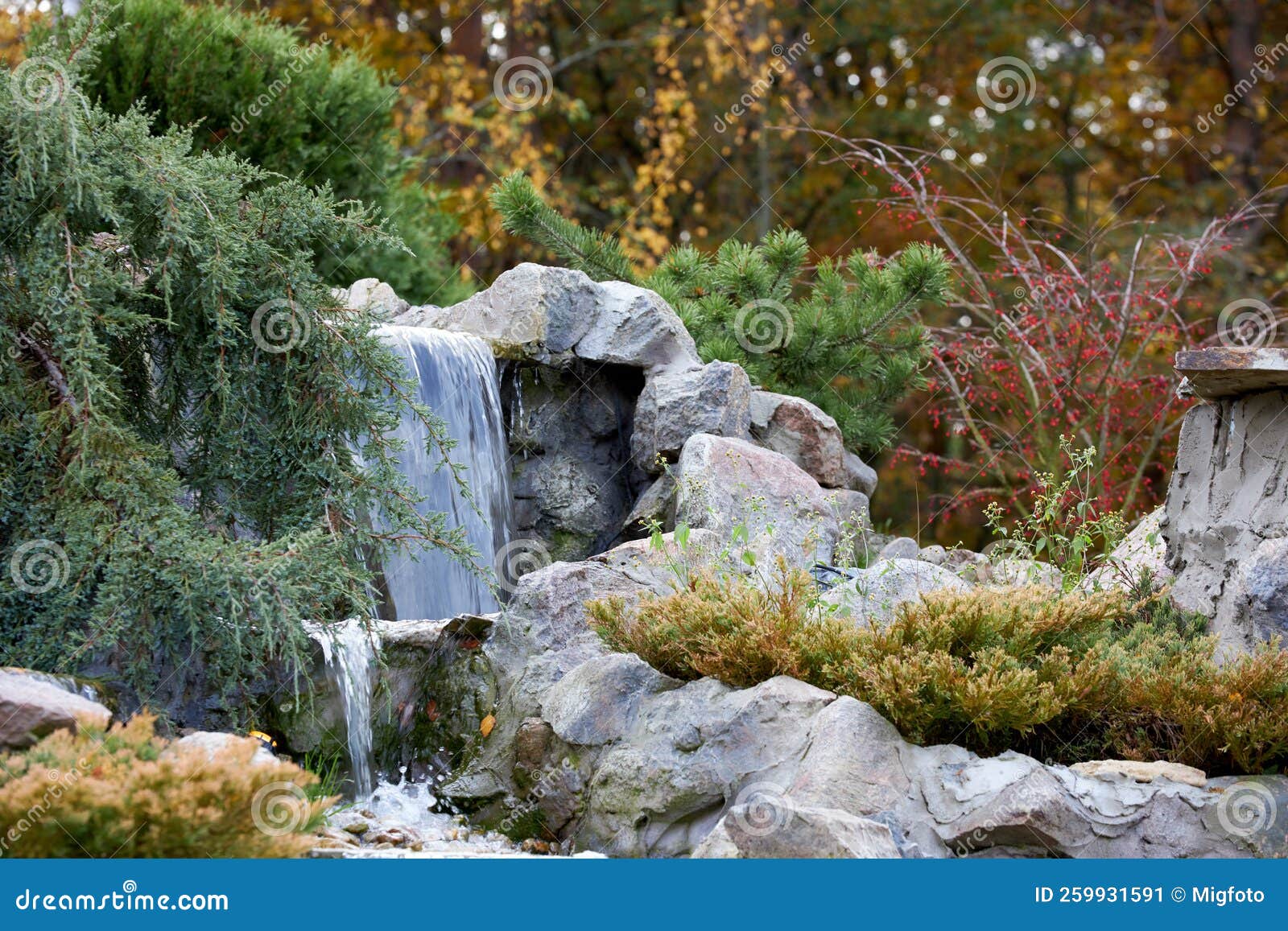 Small decorative waterfall stock image. Image of fluid - 259931591
