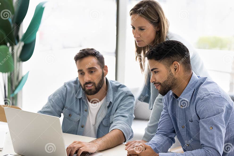 Small Diverse Business Team Meeting at Office, Watching Online Content ...