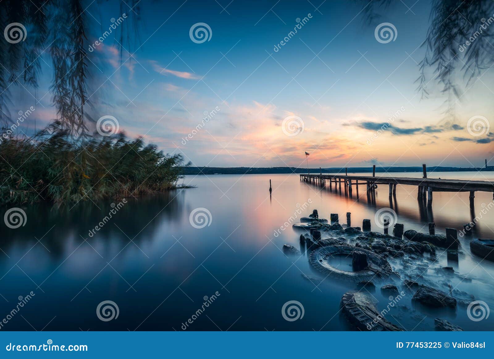 Small Dock and Sunset at the Lake Stock Image - Image of horizon, blue ...
