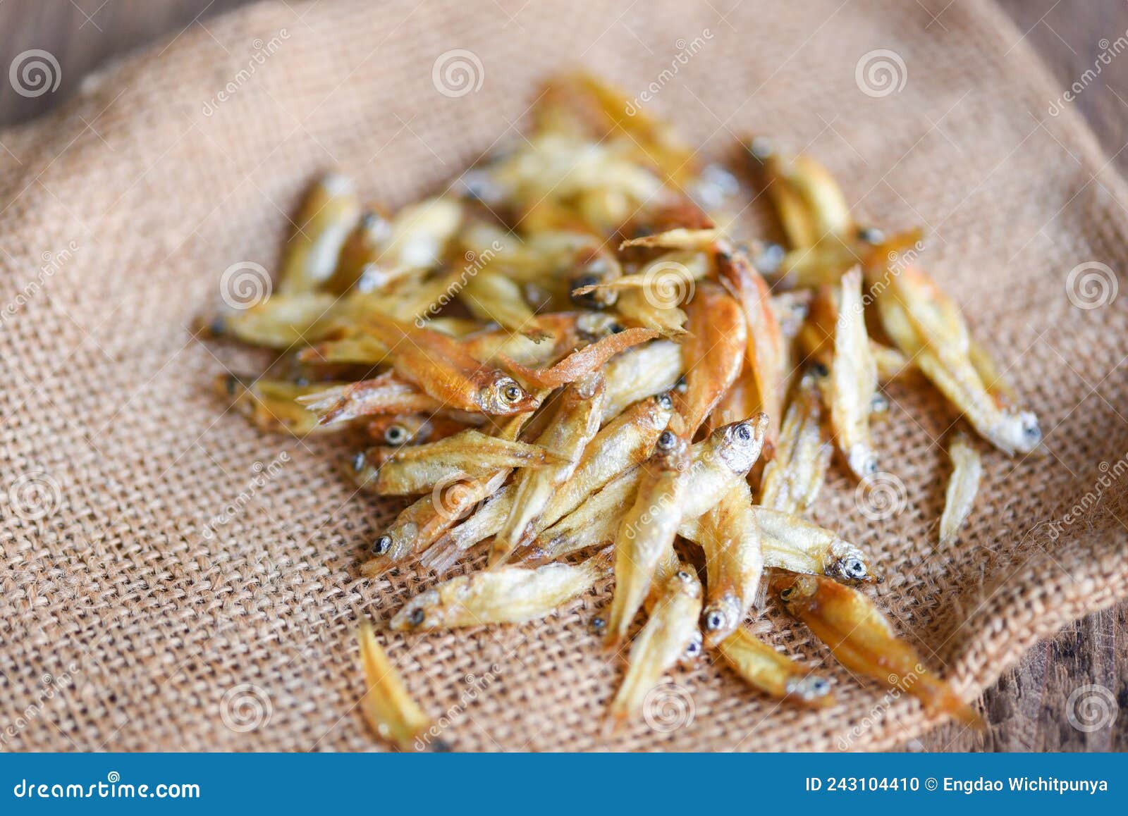 Small Dried Fish on the Sack Background, Crispy Fish for Snack Stock ...