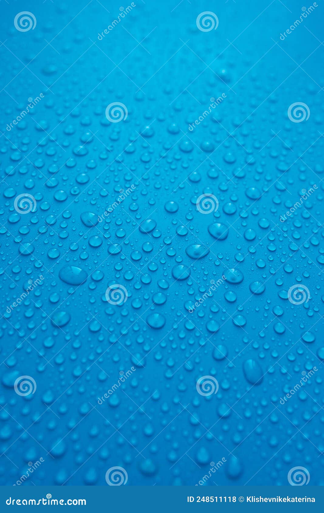 Small Drops of Water on a Blue Background with Natural Light Stock ...