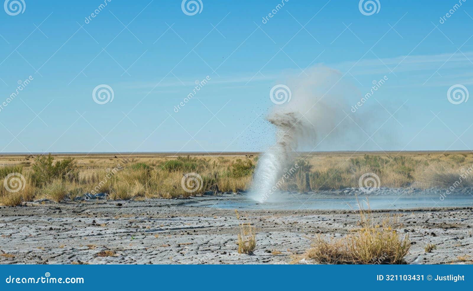 A Small Dust Devil Forming Over a Driedup Watering Hole Sending a Cloud ...