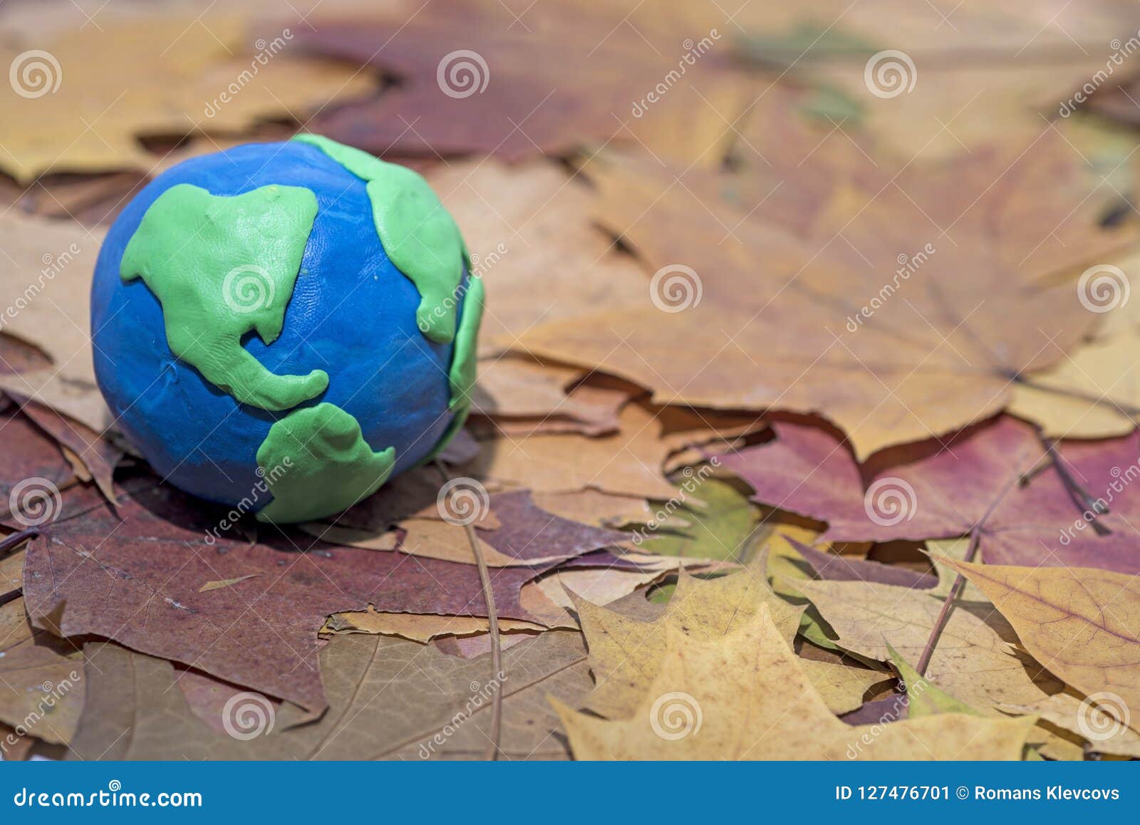Small Earth Model on Autumn Leaves Abstract Composition of Peace Stock ...