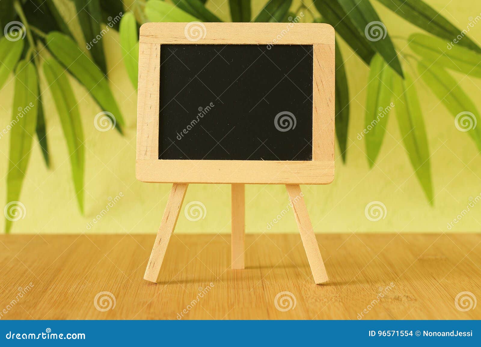 Small Empty Blackboard To Write a Message Posed on an Easel on a Wooden ...
