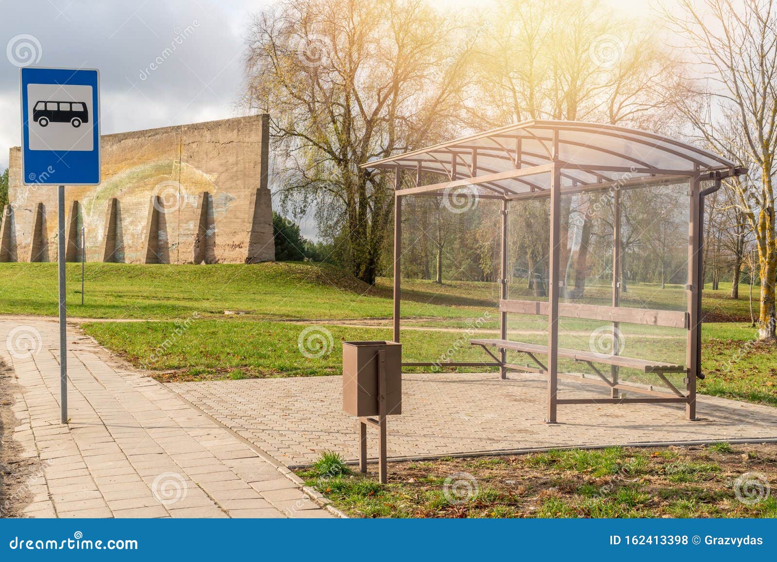 Small Empty Bus Stop on the Roadside Stock Photo - Image of pole ...