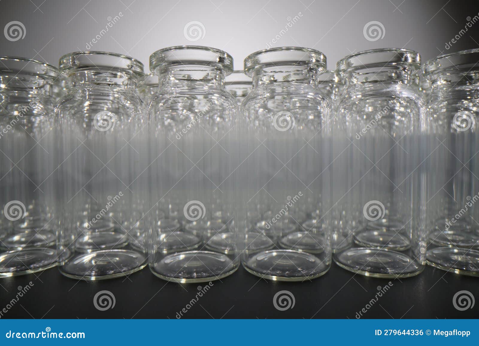 Small Empty Glass Bottles on Black Table in Laboratory Stock Photo ...