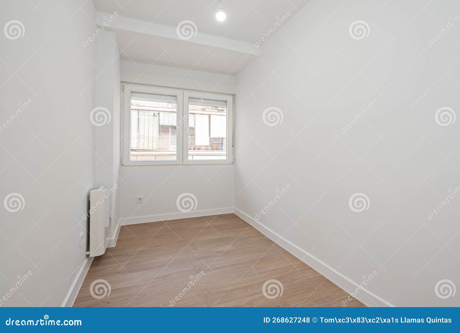 Small Empty Room With Laminated Flooring, Double-paned White Aluminum ...