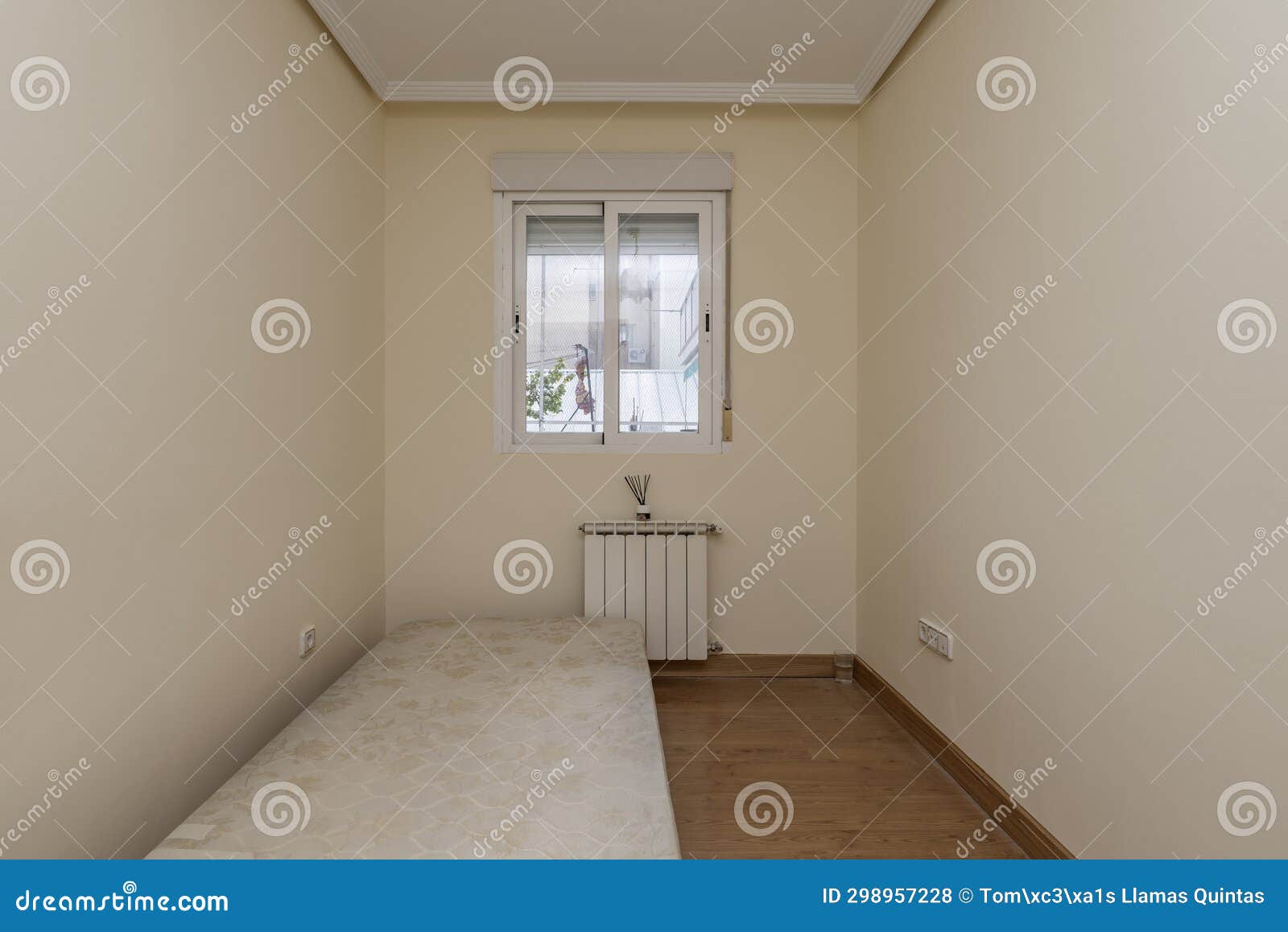 A Small Empty Room with an Old Folding Sofa and a White Aluminum ...