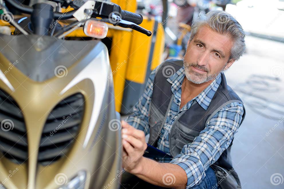 Small Engine Mechanic Posing Stock Photo - Image of repair, inspection ...