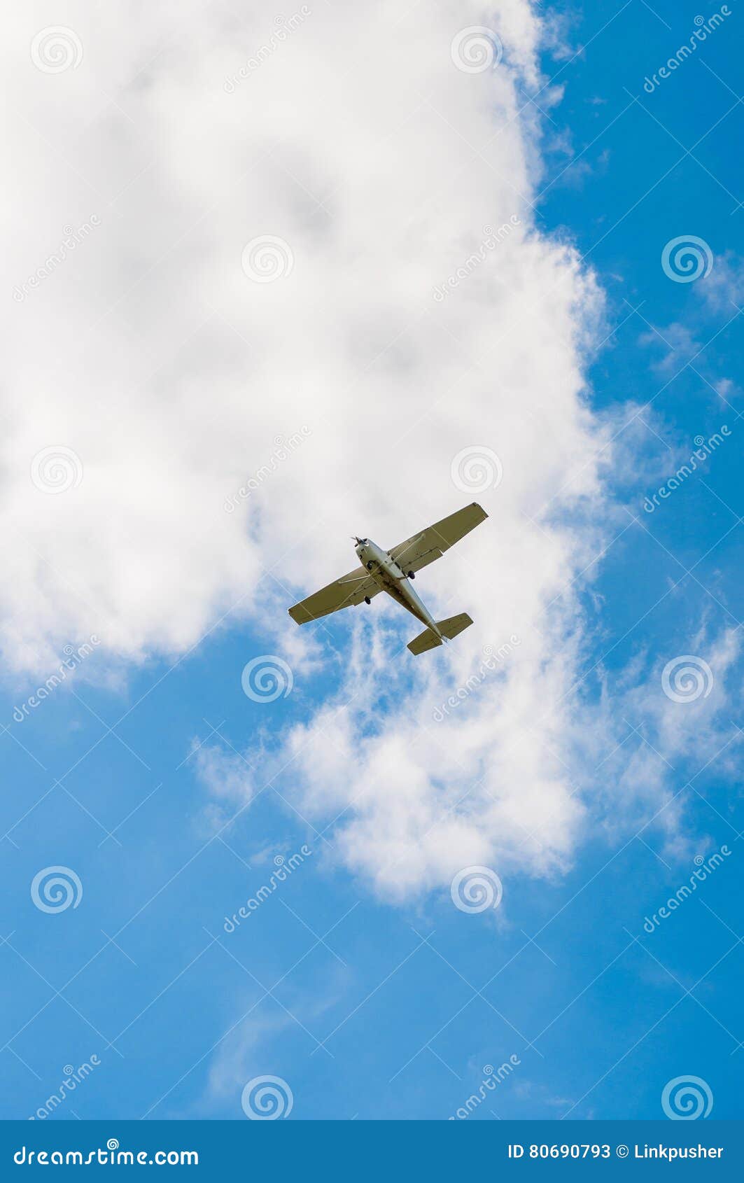 Small-engine Plane In A Blue Sky On A Background Of Clouds Royalty-Free ...