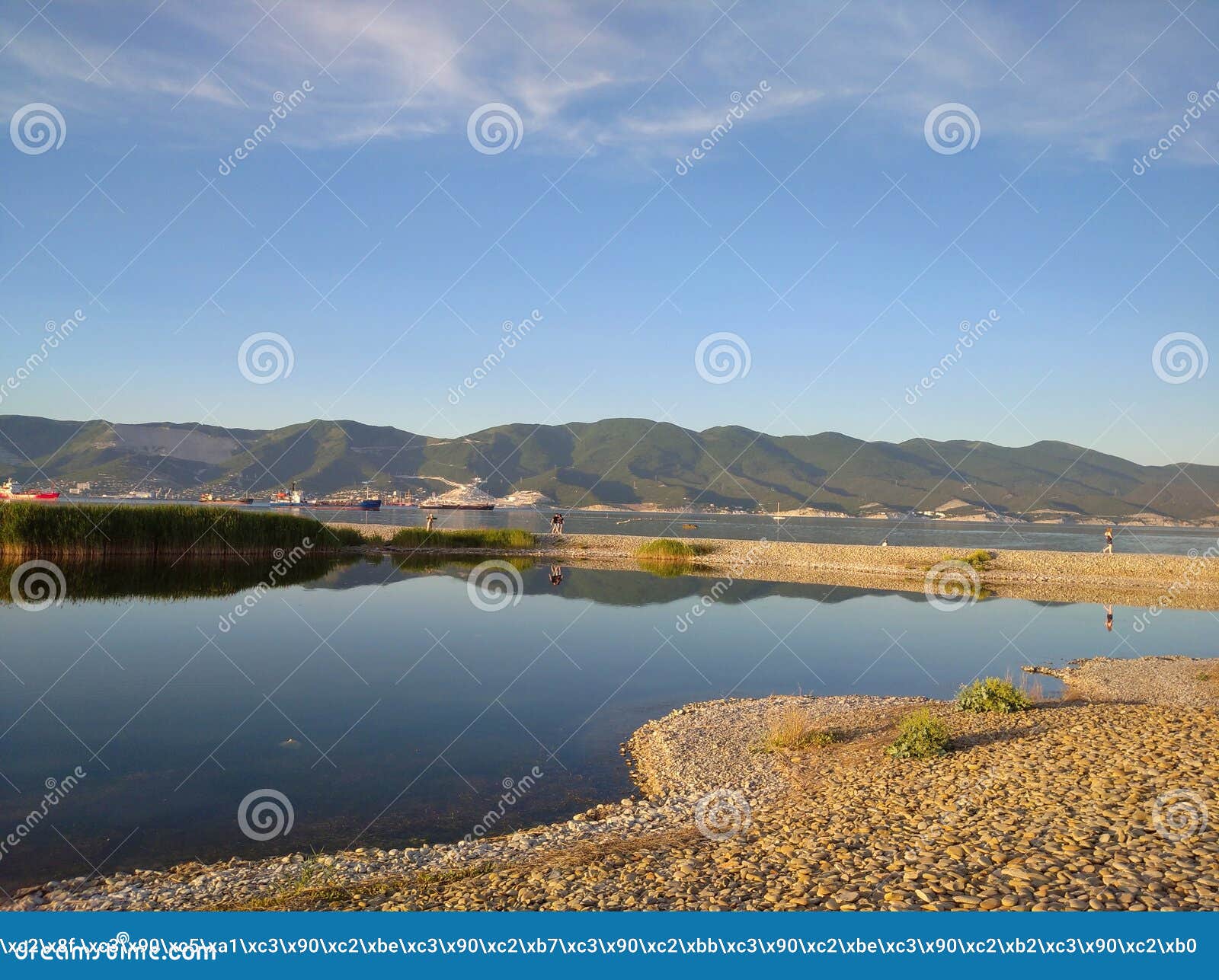 Small Estuary Against the Background of Mountains and Sky Stock Photo ...