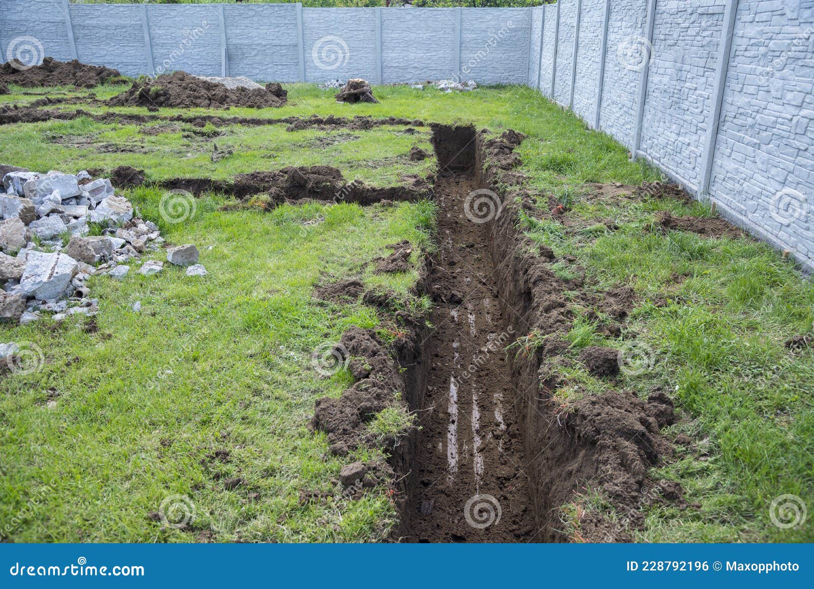 Small Excavator is Digging a Foundation for a House Stock Photo - Image ...