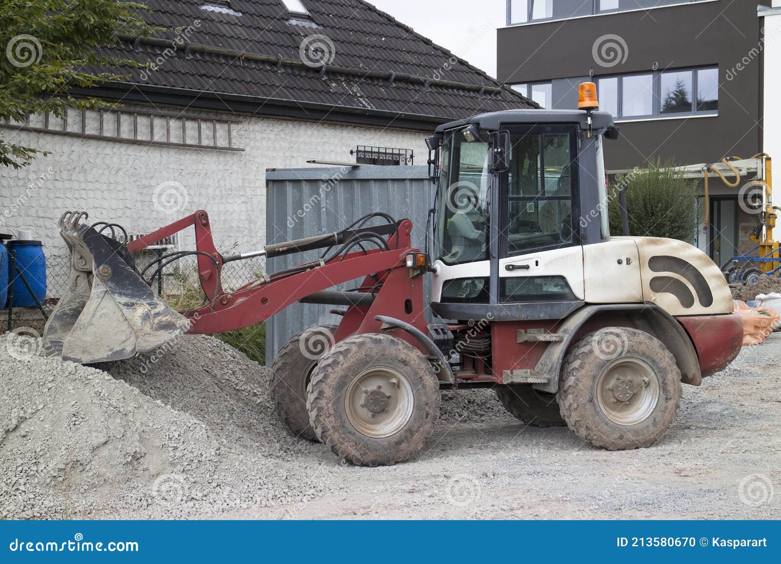 Small Excavator Digging Gravel on a Construction Site Editorial Image ...