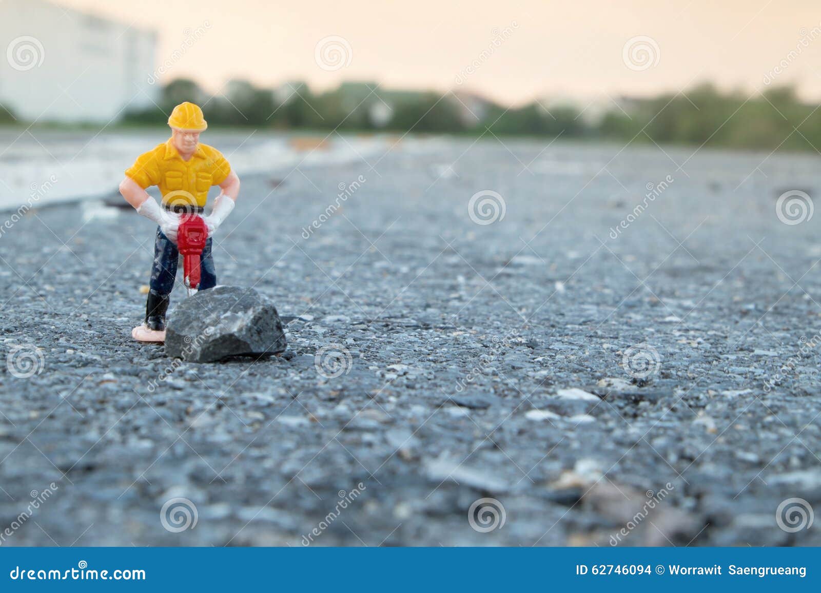 Small Figure of a Man Digging Concrete Road Stock Photo - Image of ...