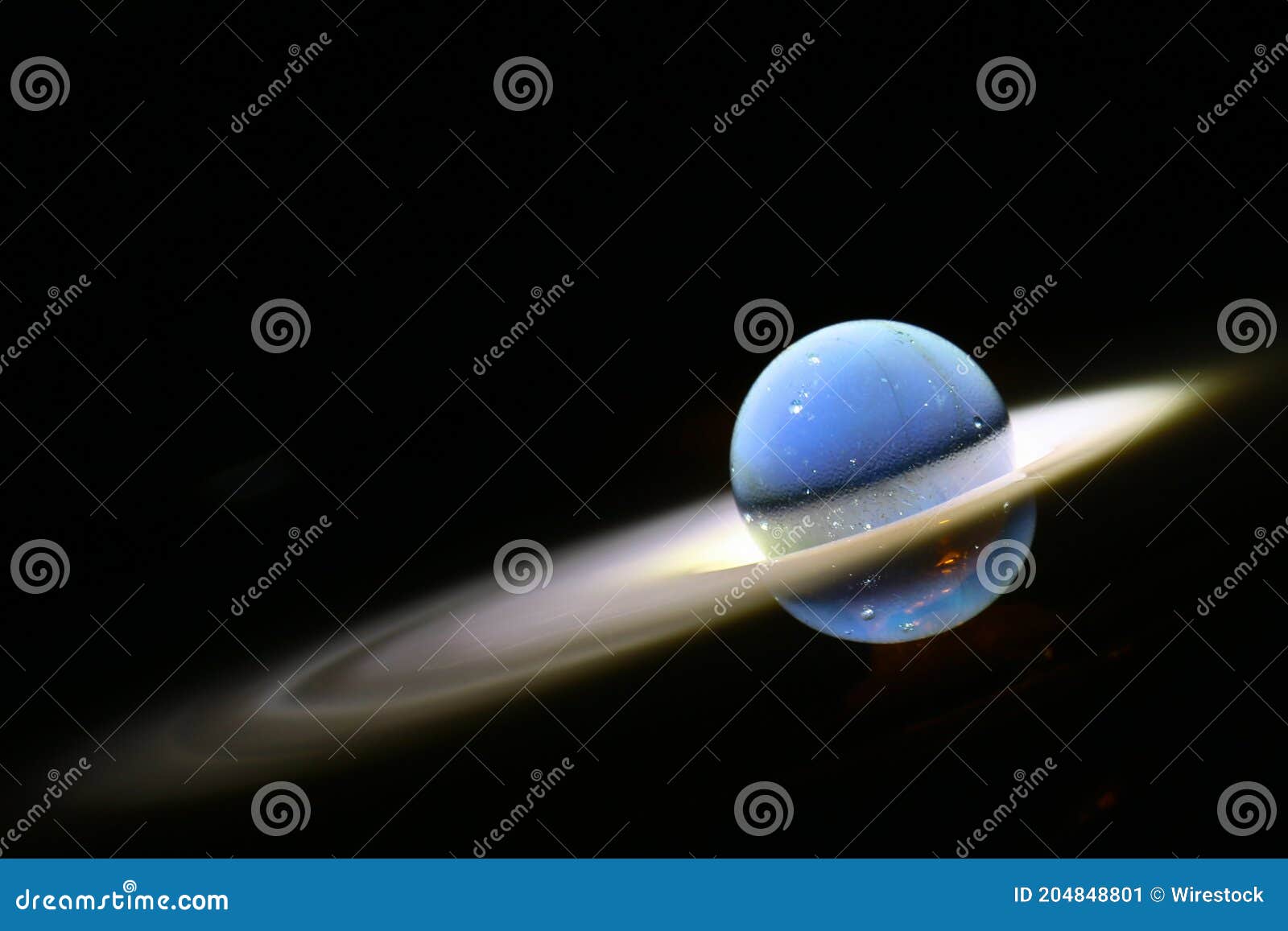 Small Figure of Neptune with a Ring Against a Dark Background Stock ...