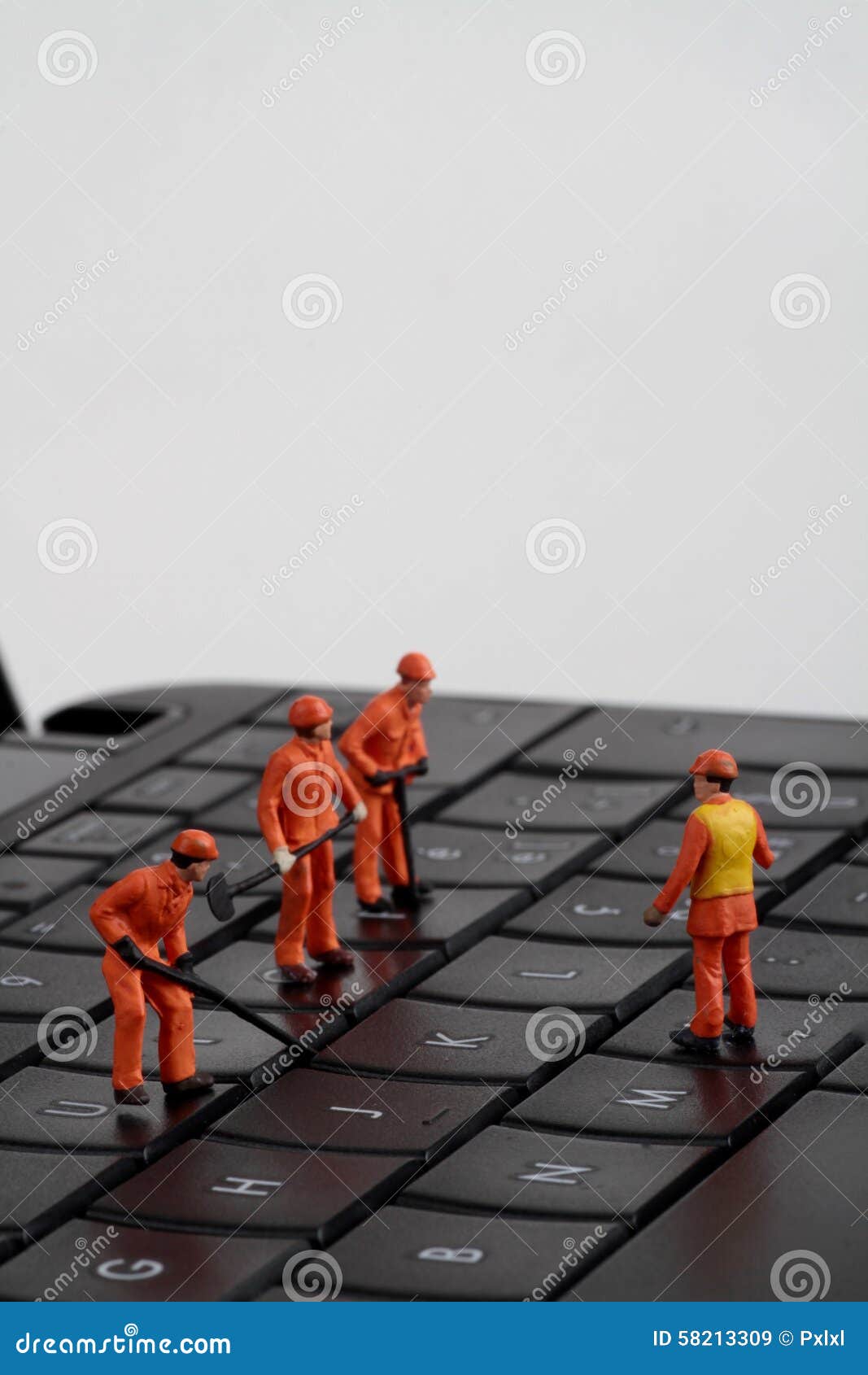 Small Figurines of Workers Repairing Computer Keyboard Stock Image ...
