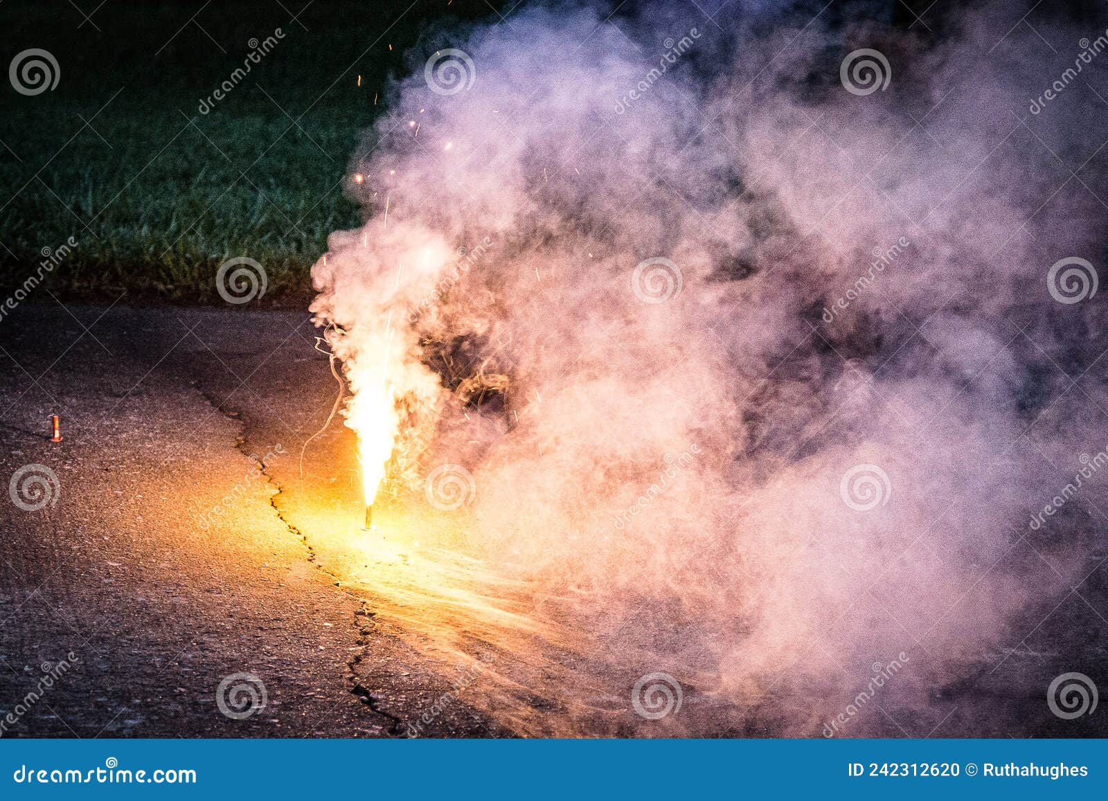 A Small Firework Display with Orange and White Smoke Stock Photo ...