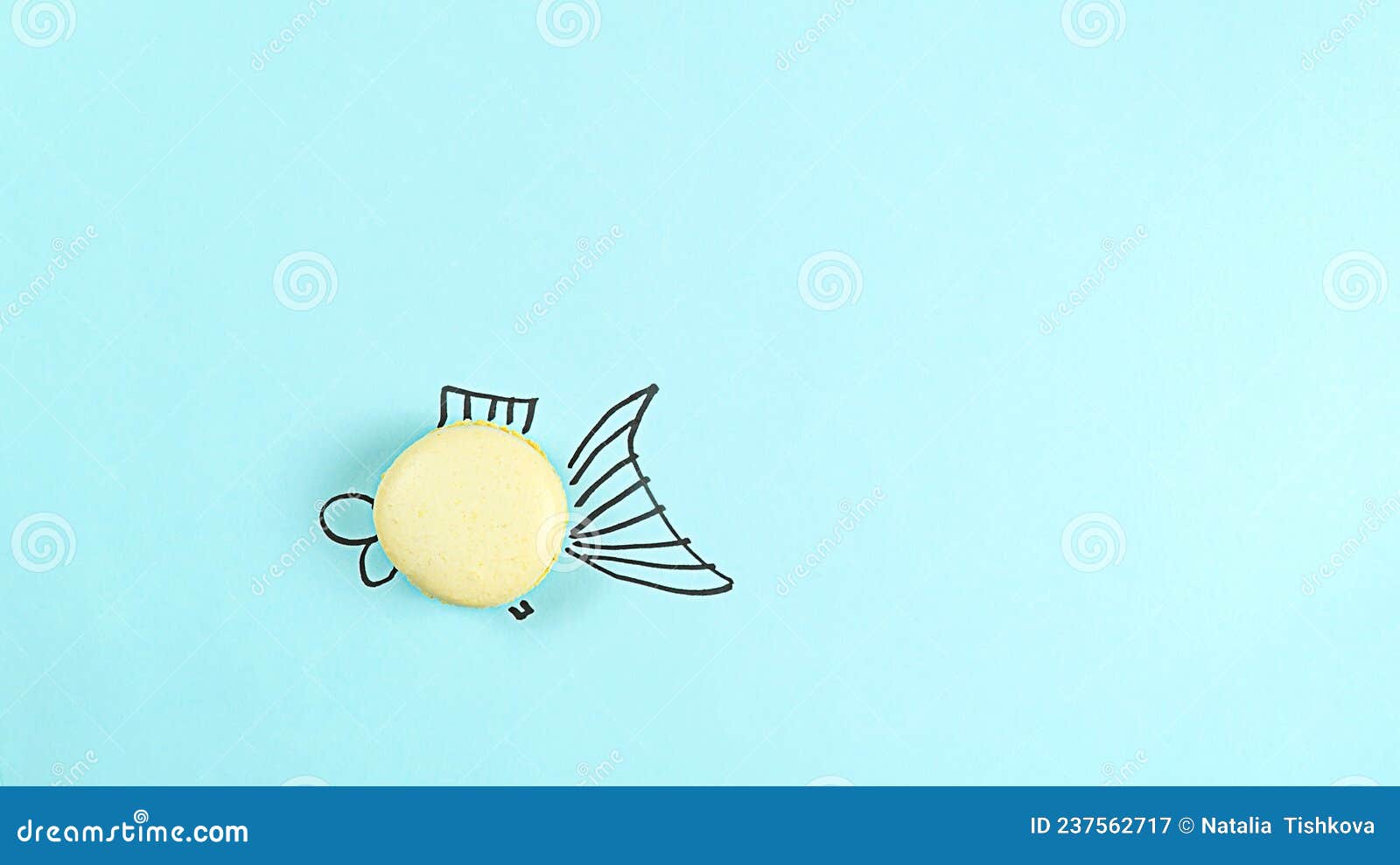 Small Fish Macaroon Cake on a Blue Background Concept with Copy Space ...