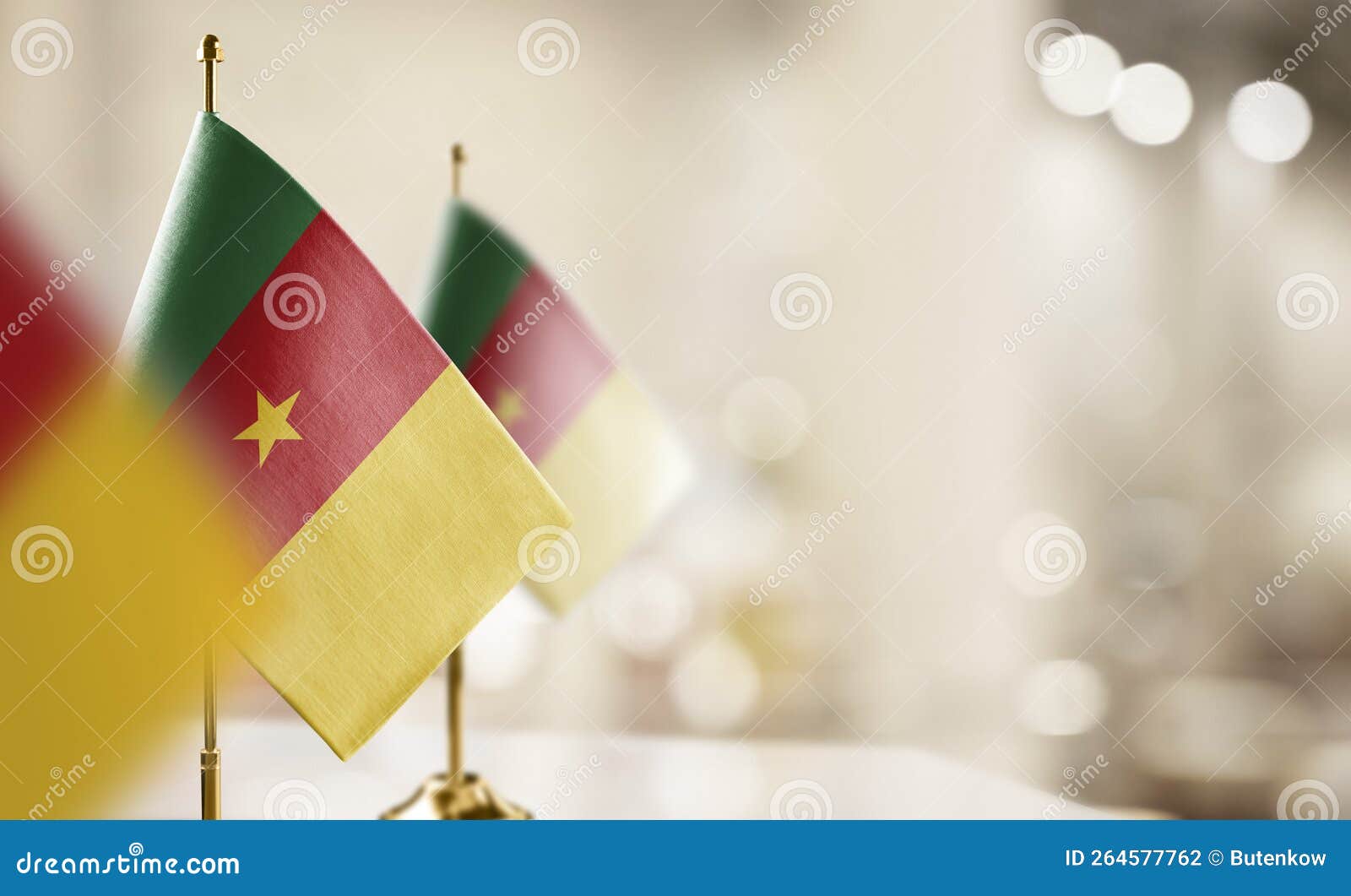 Small Flags of the Cameroon on an Abstract Blurry Background Stock Illustration - Illustration ...