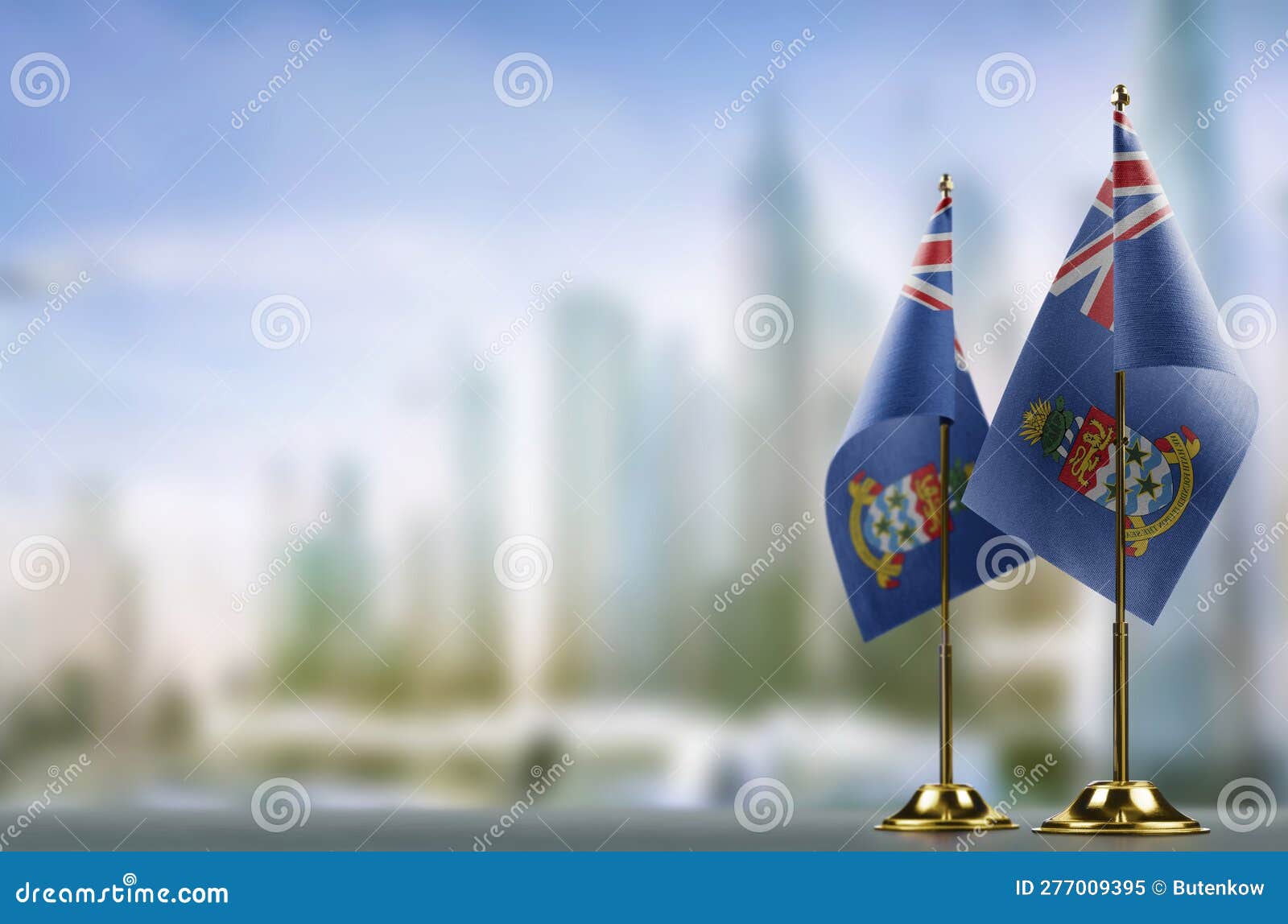 Small Flags of the Cayman Islands on an Abstract Blurry Background ...