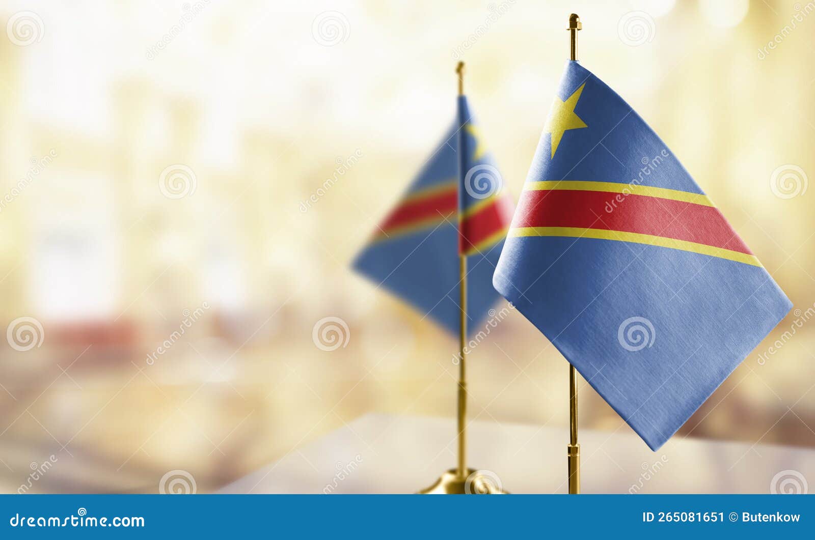Small Flags of the Democratic Republic of the Congo on an Abstract ...