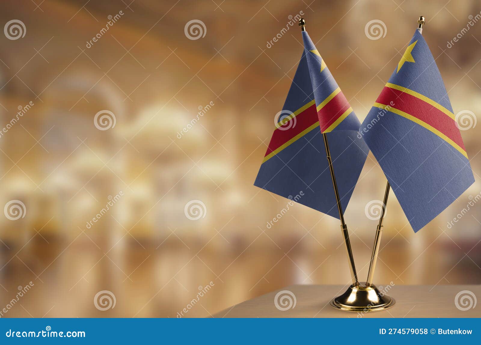 Small Flags of the Democratic Republic of the Congo on an Abstract ...