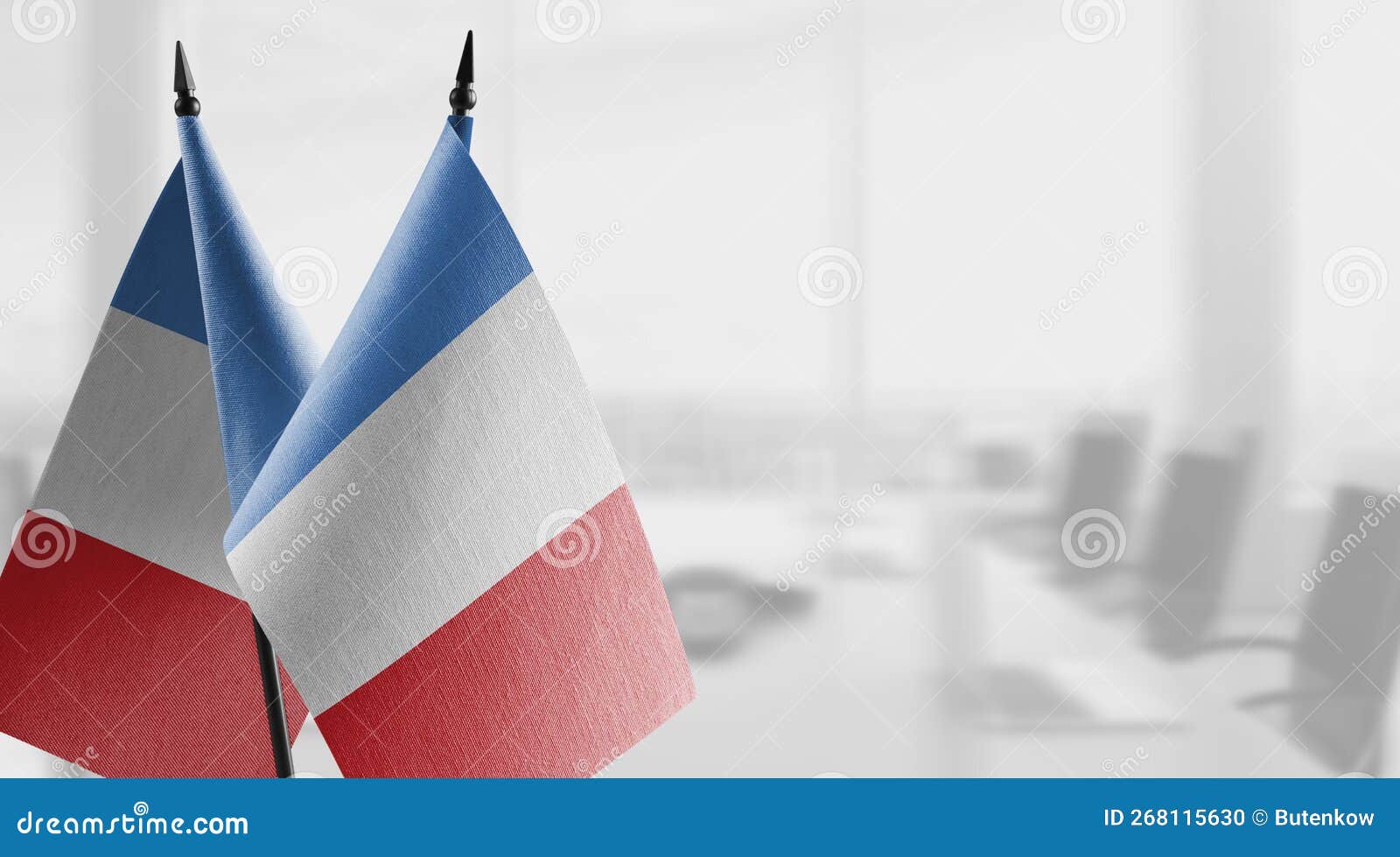 Small Flags of the France on an Abstract Blurry Background Stock Photo ...