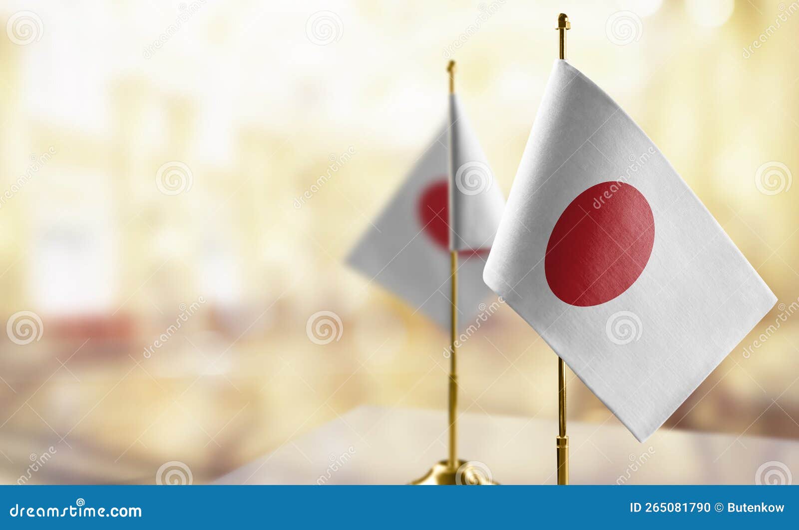 Small Flags of the Japan on an Abstract Blurry Background Stock Photo ...