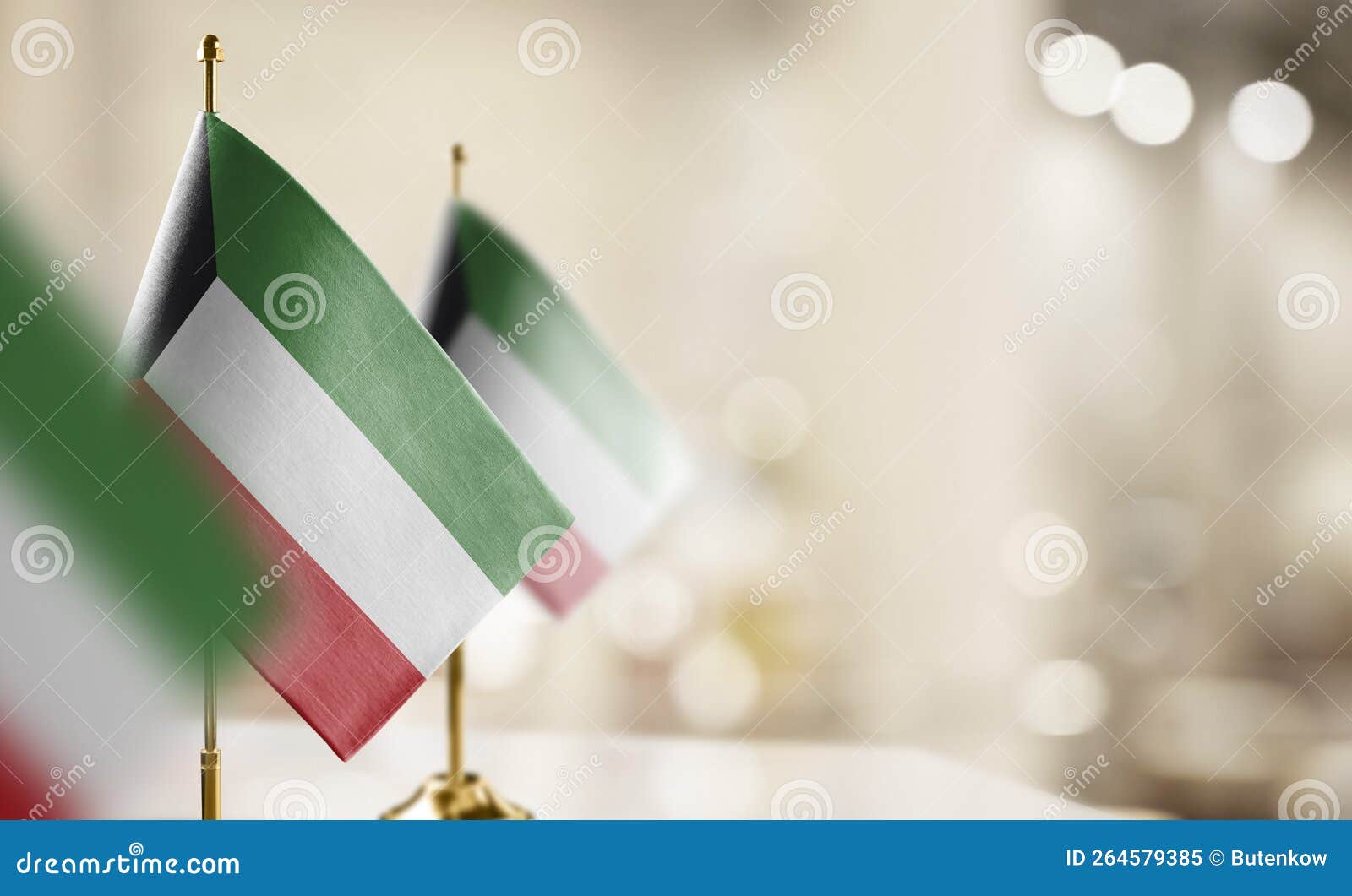 Small Flags of the Kuwait on an Abstract Blurry Background Stock ...