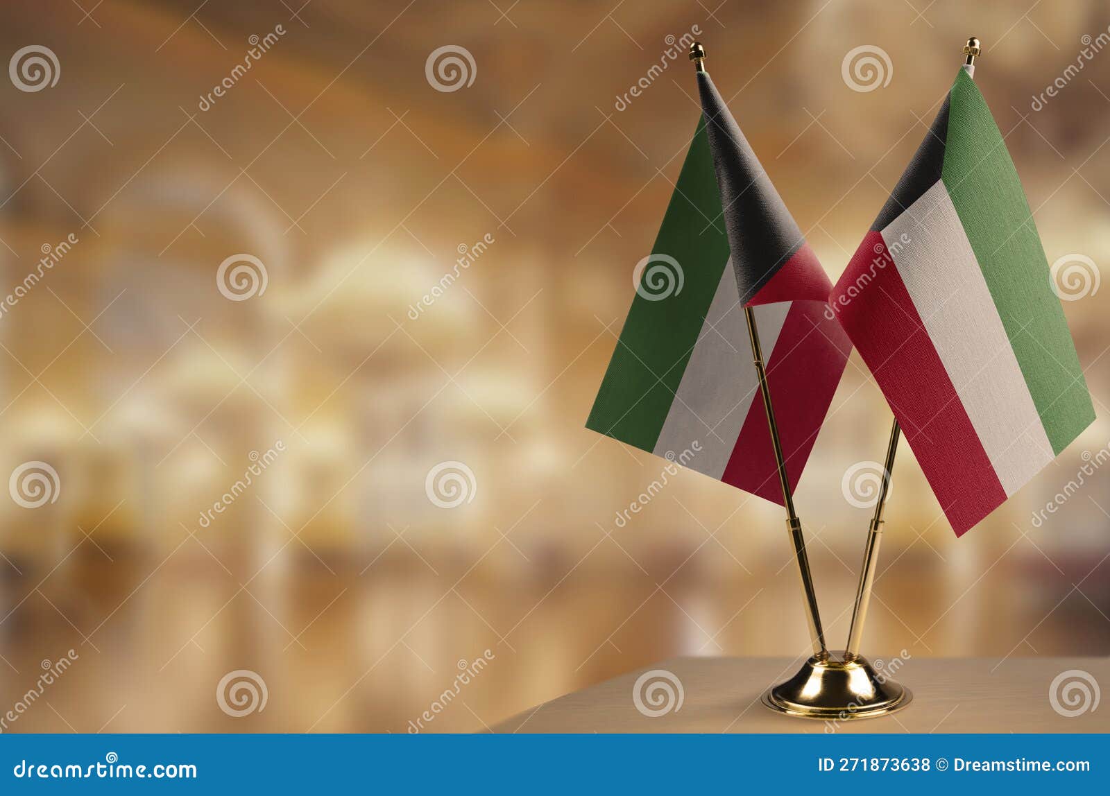 Small Flags of the Kuwait on an Abstract Blurry Background Stock Photo ...