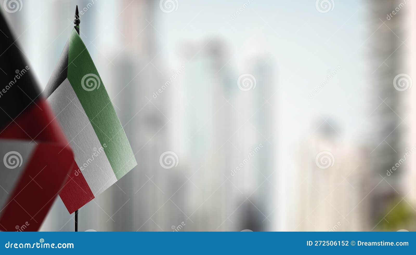 Small Flags of the Kuwait on an Abstract Blurry Background Stock Photo ...