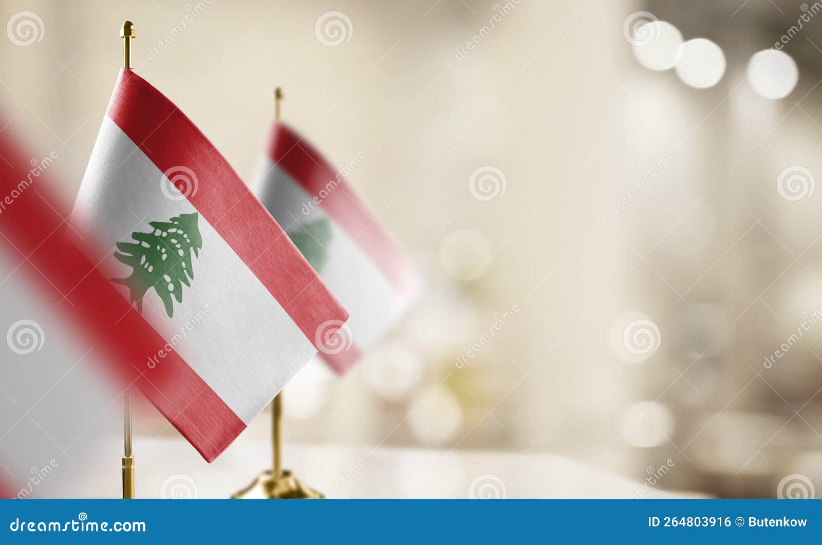 Small Flags of the Lebanon on an Abstract Blurry Background Stock Photo ...