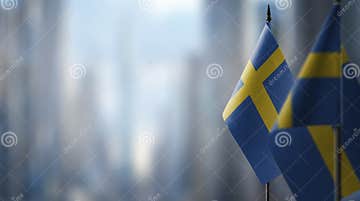 Small Flags of the Sweden on an Abstract Blurry Background Stock Photo ...