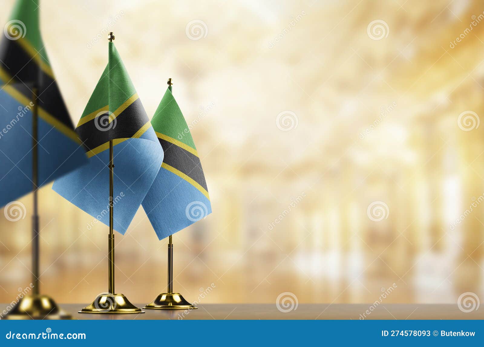Small Flags of the Tanzania on an Abstract Blurry Background Stock ...