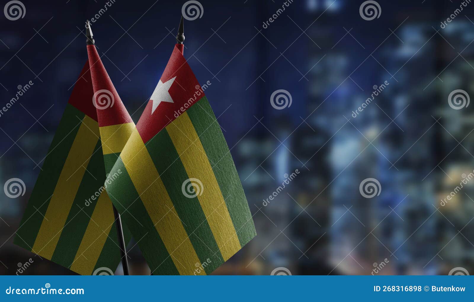 Small Flags of the Togo on an Abstract Blurry Background Stock Photo ...