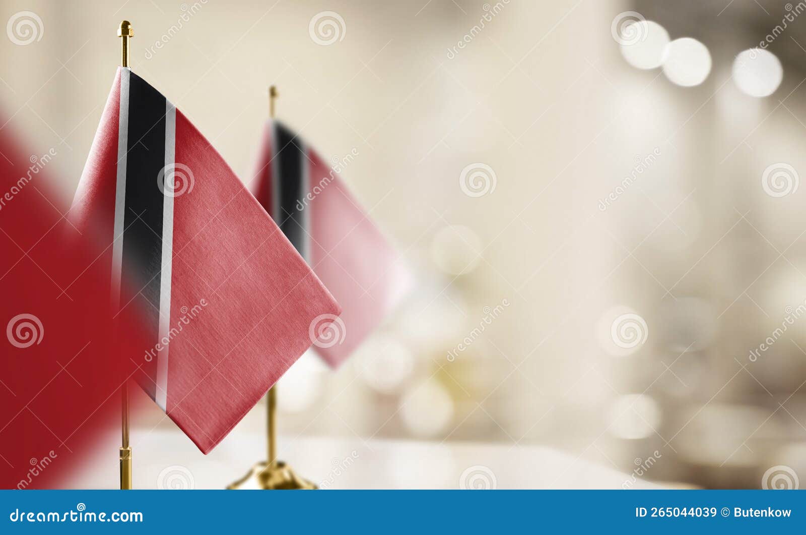 Small Flags of the Trinidad and Tobago on an Abstract Blurry Background ...