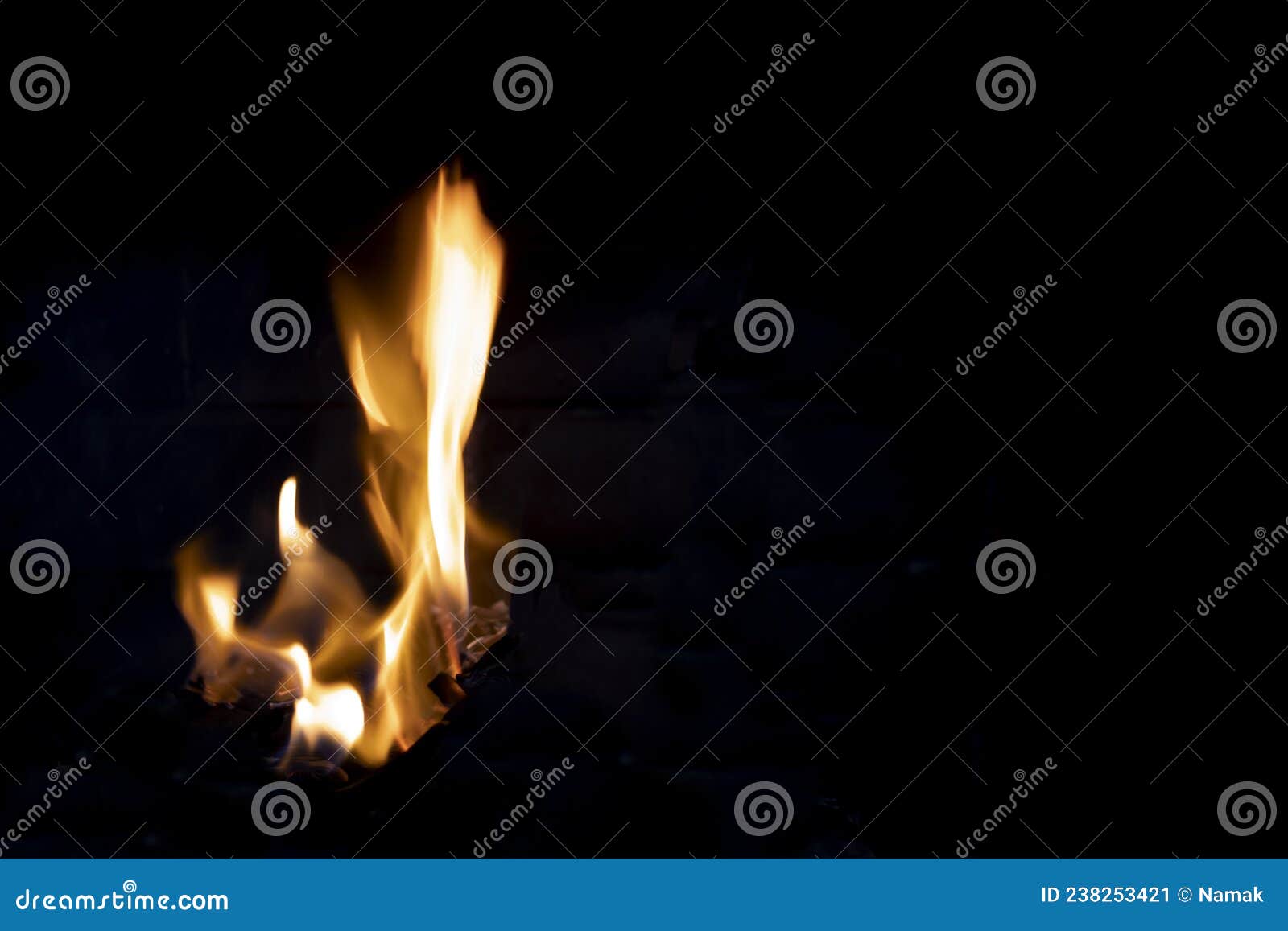 Small Flame of Fire on a Black Background, Horizontal Stock Image ...